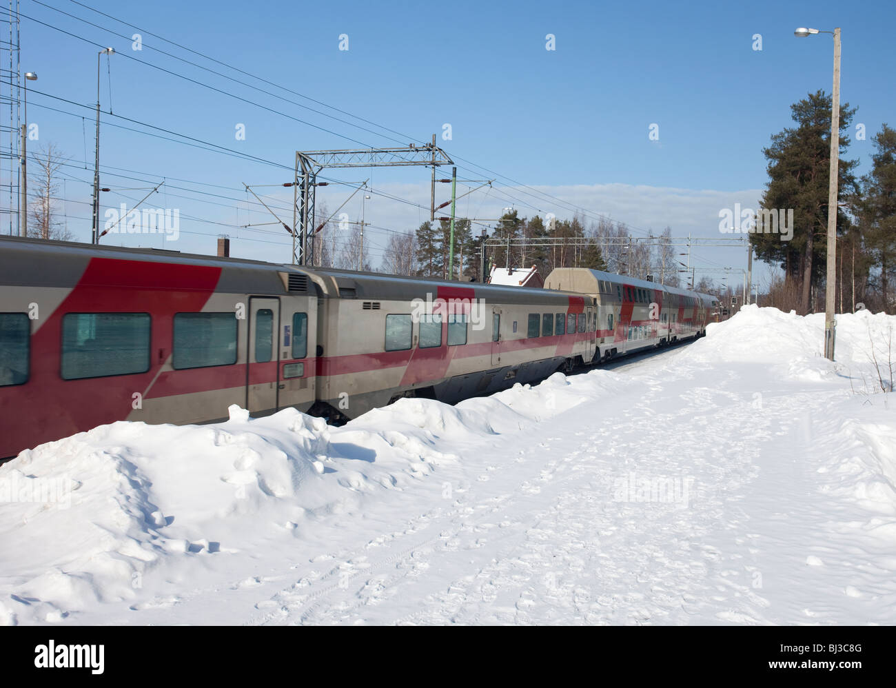 Finnish long distance Intercity train leaving from railroad station at ...