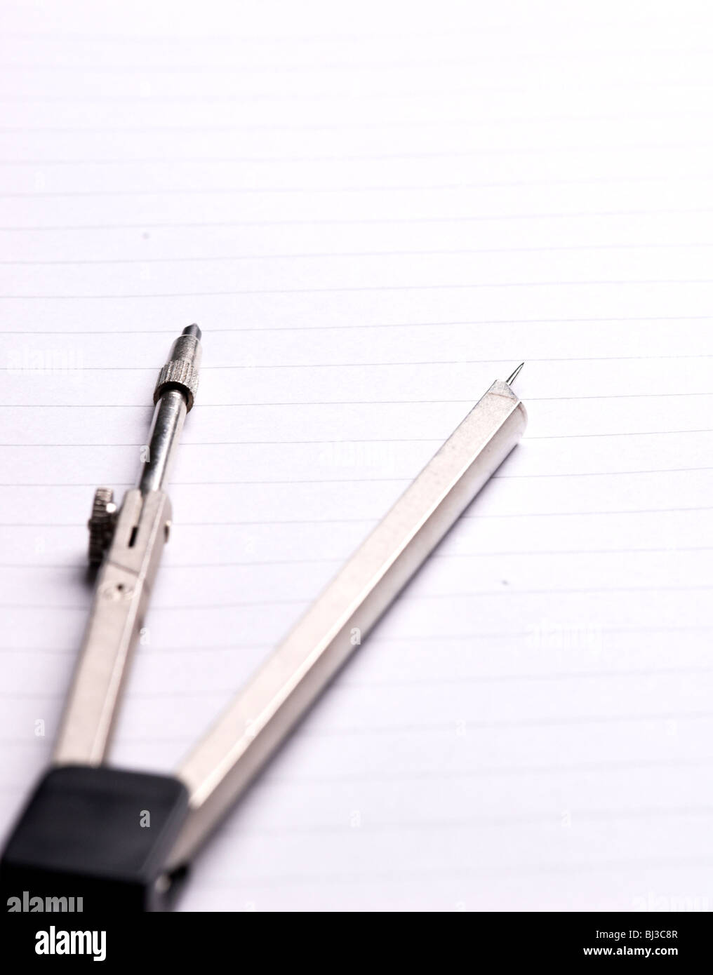 Compass on lined paper Stock Photo - Alamy