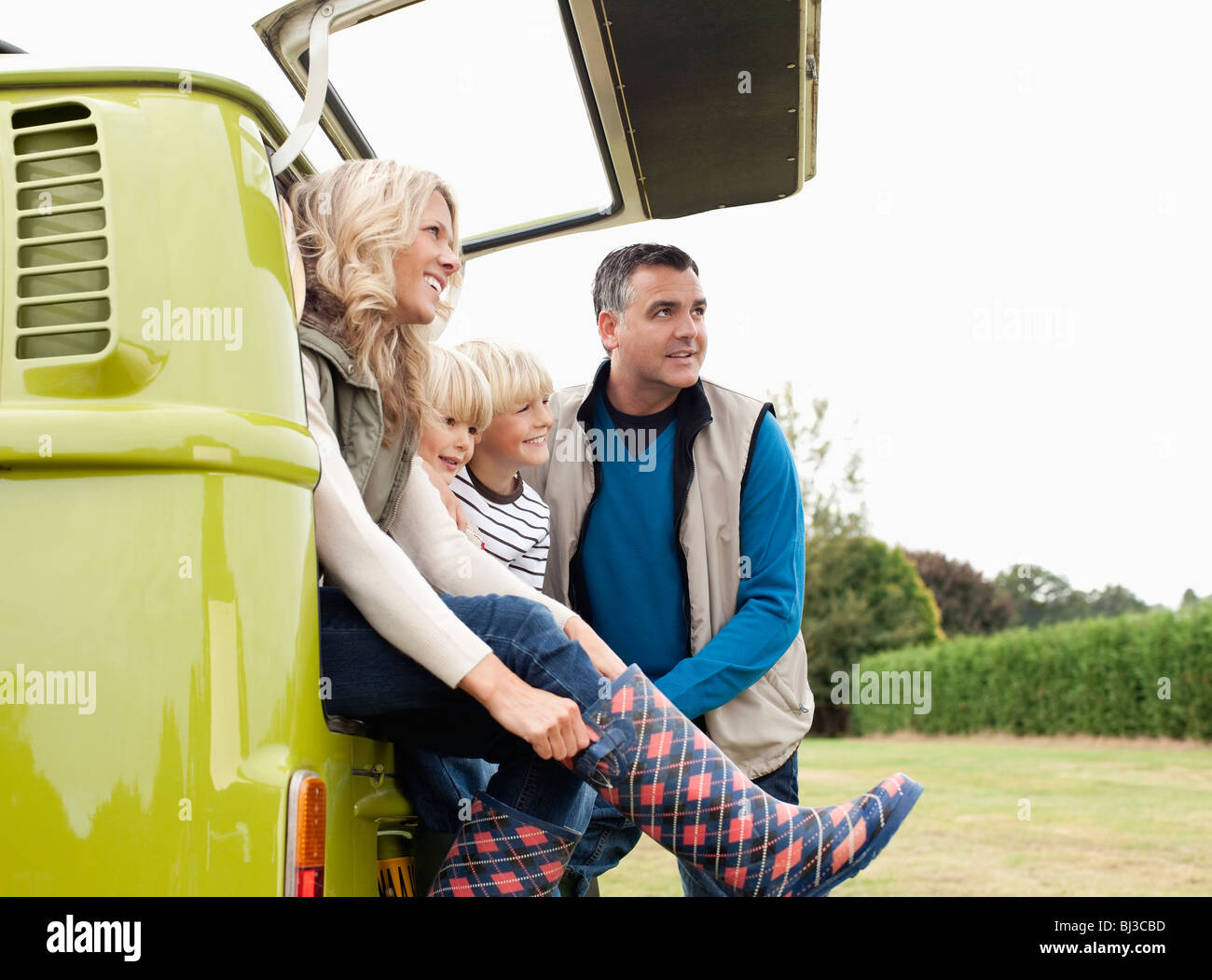 Family at back of camper van Stock Photo - Alamy