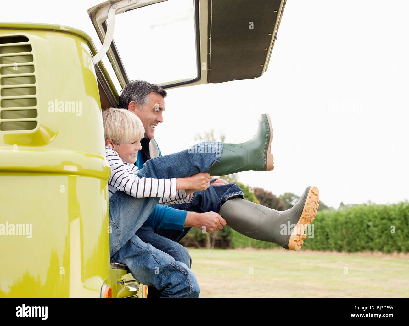 Putting on boots hi-res stock photography and images - Alamy