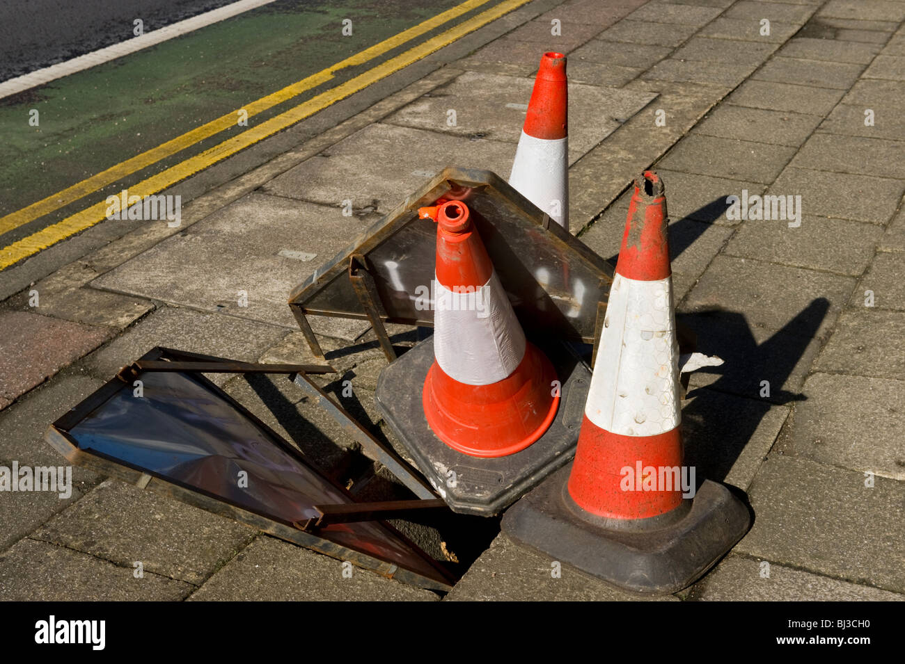 Traffic road cones over pavement damage on a street in Uxbridge West ...