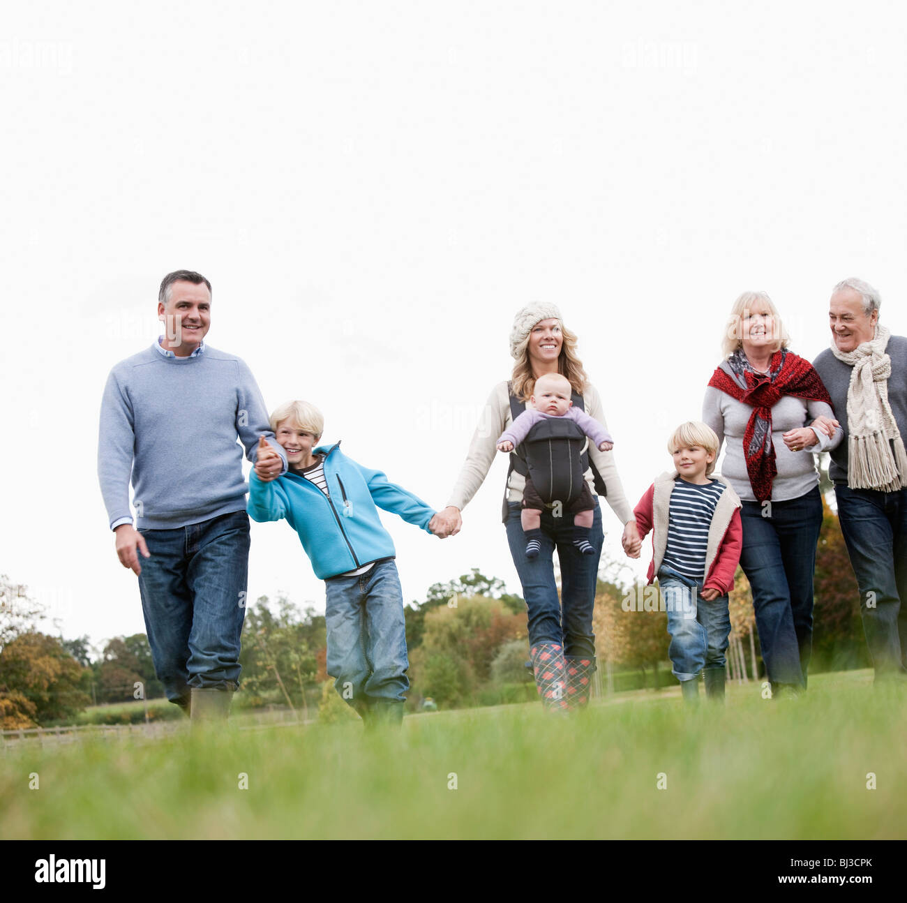 Happy multi generation family walking in hi-res stock photography and ...