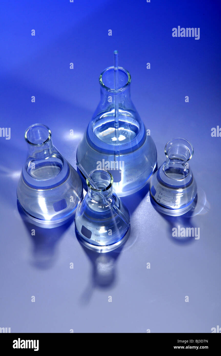 Various Flasks with liquid permeated with blue light Stock Photo - Alamy