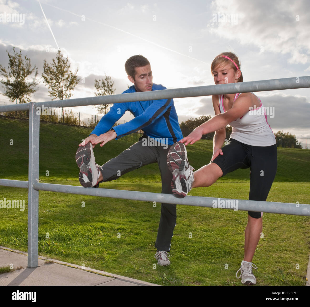 athletes stretching together Stock Photo - Alamy