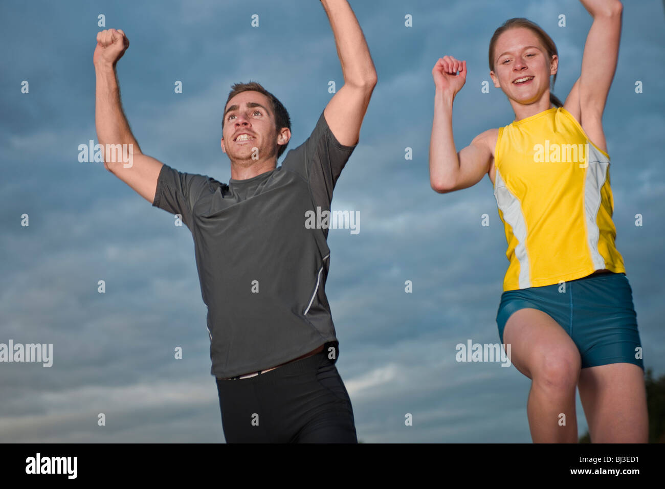 Action arms raised celebrating sport hi-res stock photography and ...