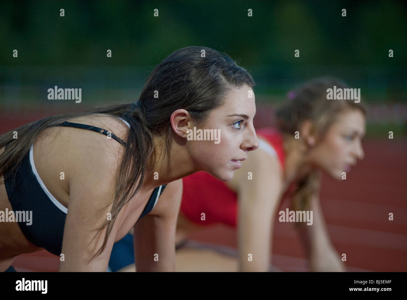 Female athletes in starting blocks hi-res stock photography and images ...