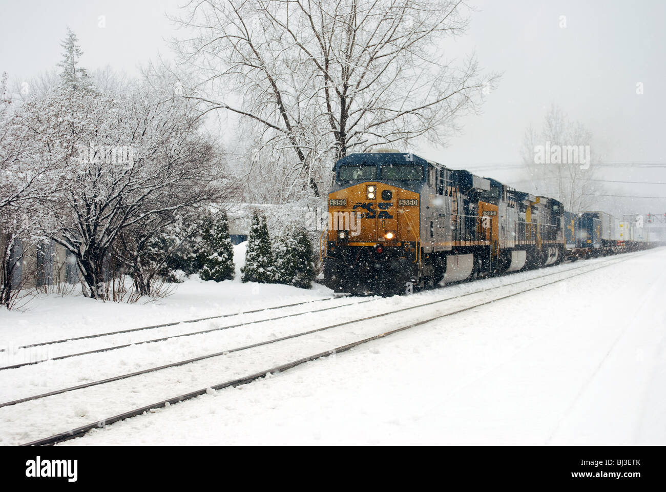 CSX freight train engine advances towards railroad crossing ...