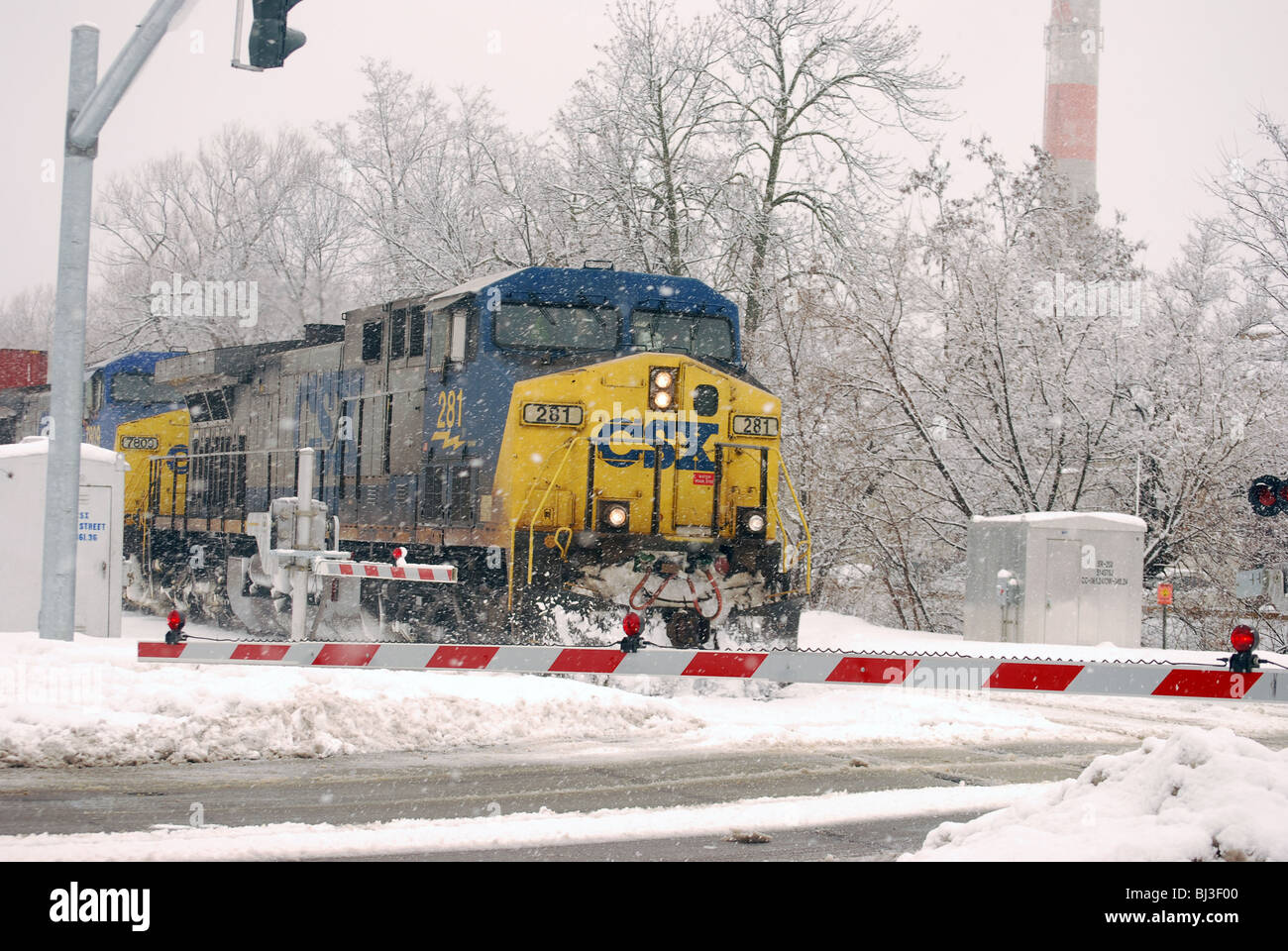 CSX freight train engine advances towards Railroad crossing ...