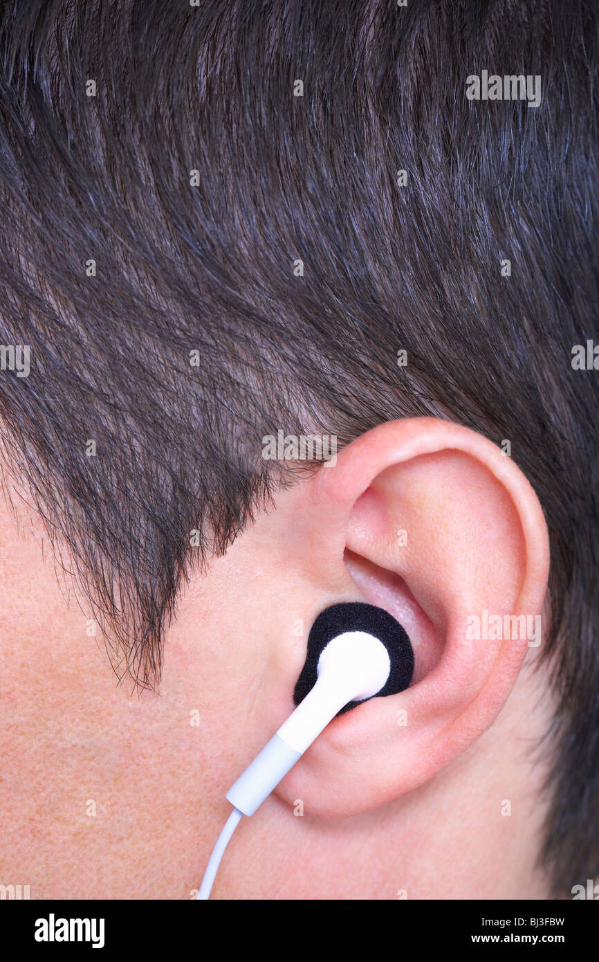 Headphone in ear hi-res stock photography and images - Alamy