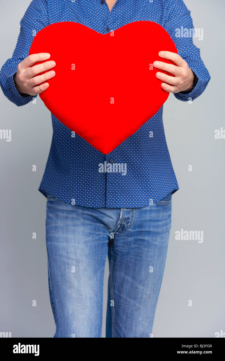 man showing a heart cropped shot Stock Photo - Alamy