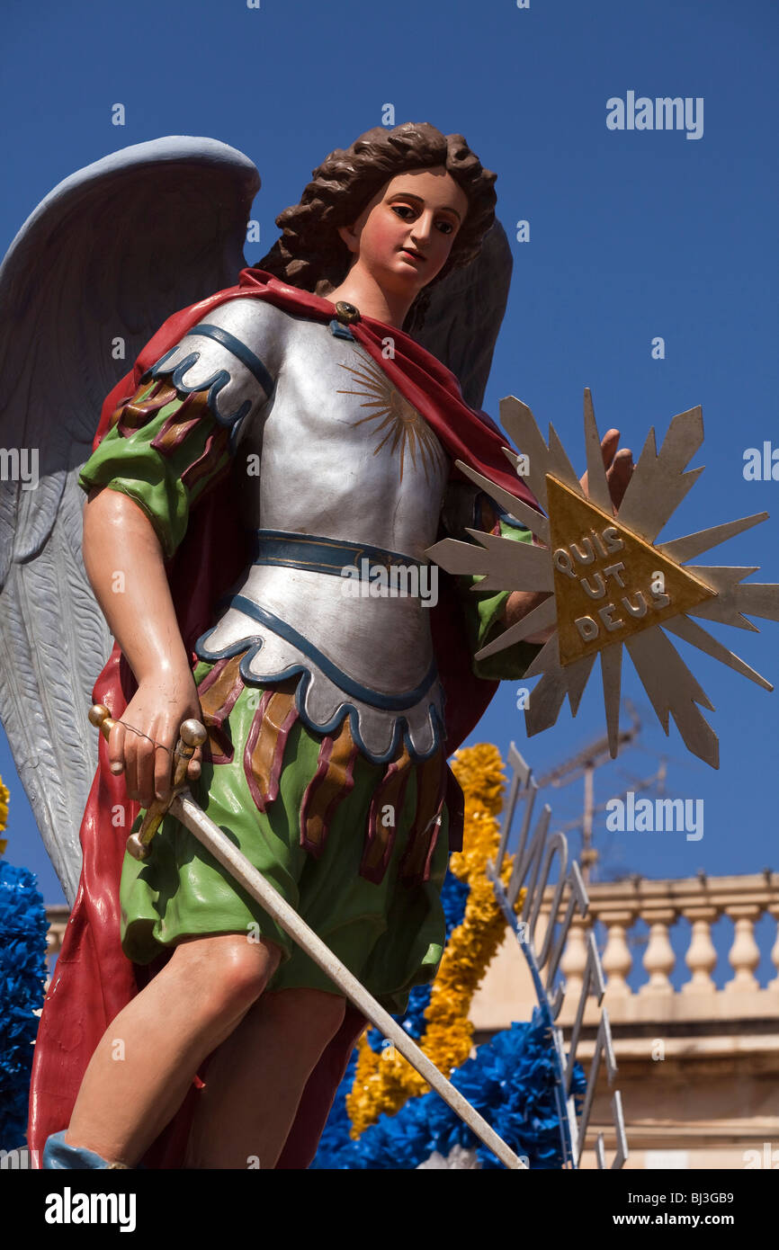 A papier-mâché statue of Saint Michael positioned for the feast of ...