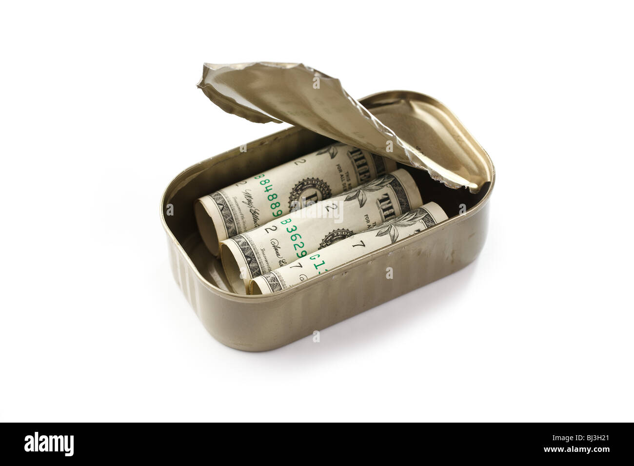 dollars in sardines can on white background Stock Photo - Alamy