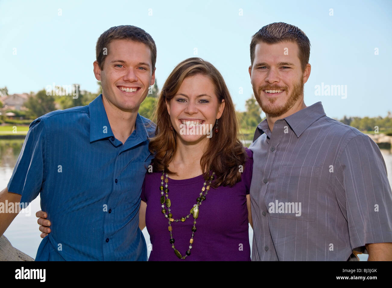 young Adult sister and brothers happily pose for the camera. MR ...