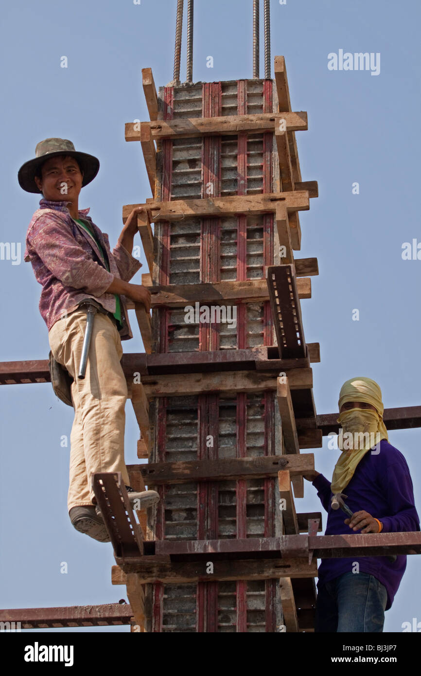 Thai construction workers, steel fixers, on a construction site ...