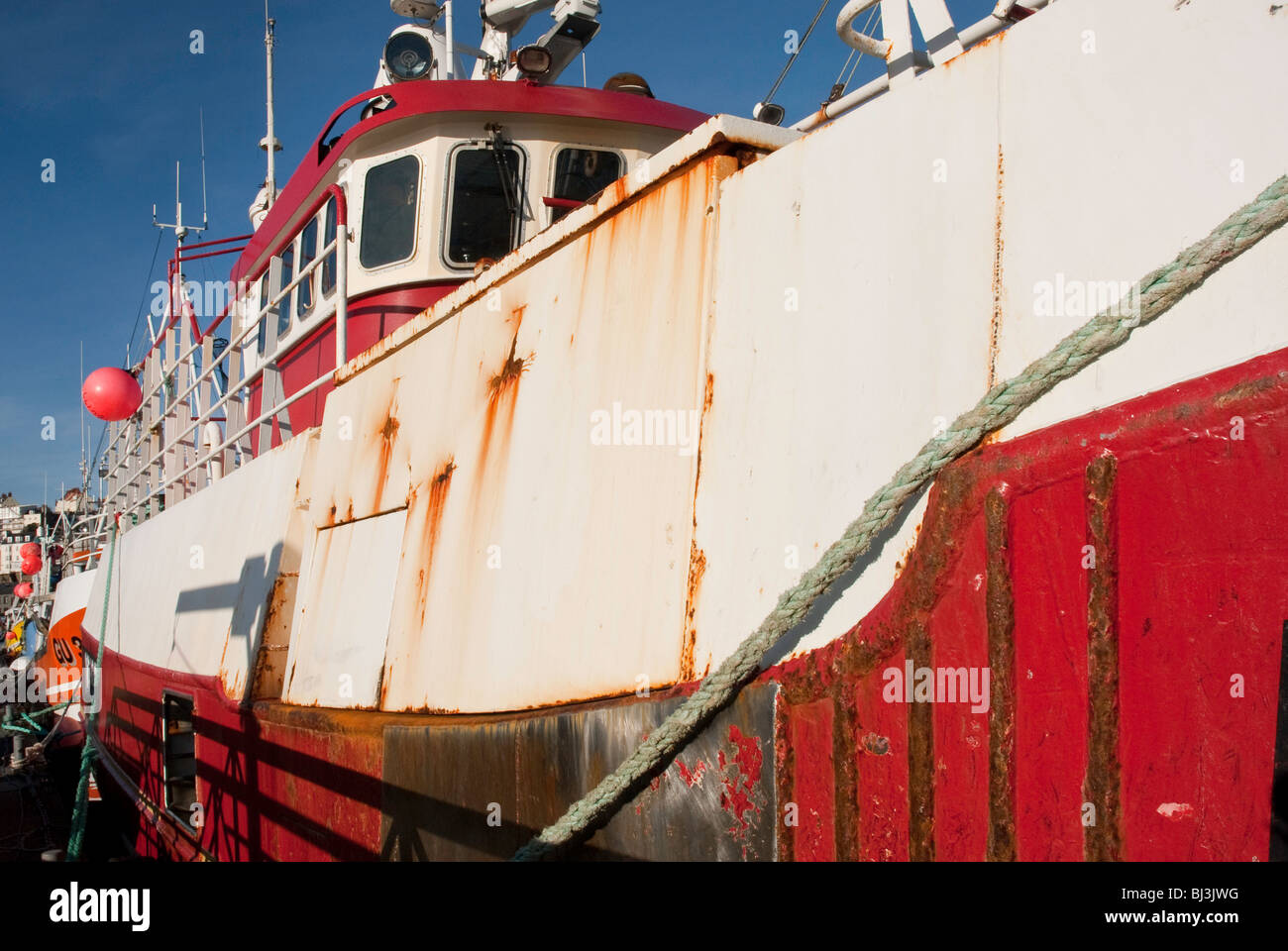 Close up of red fishing boat Stock Photo - Alamy