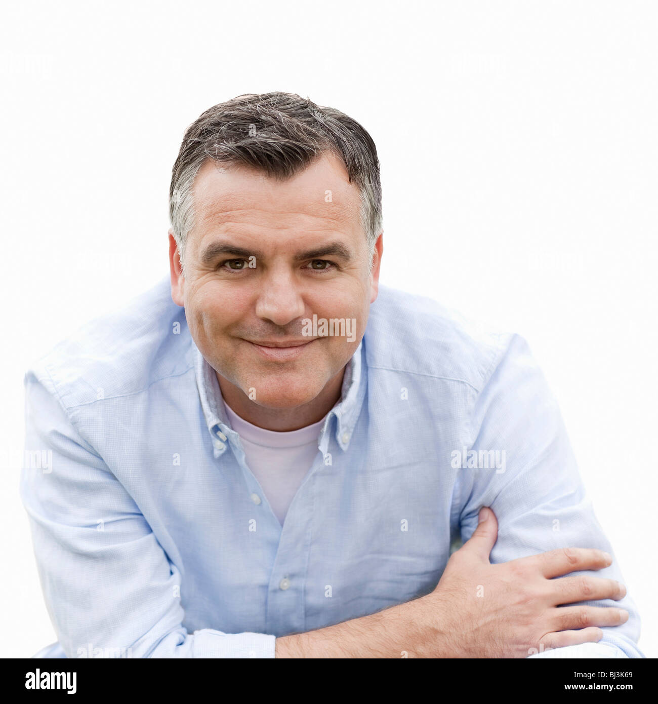 Portrait of man smiling at camera Stock Photo - Alamy