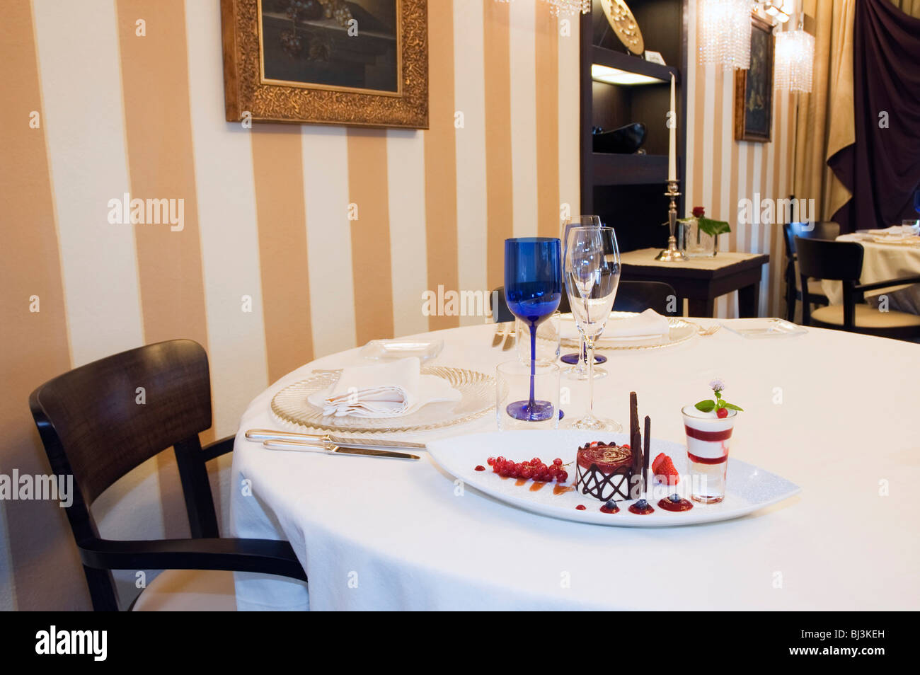 Dessert on set table in the top class restaurant Aquamatta, Capolona ...