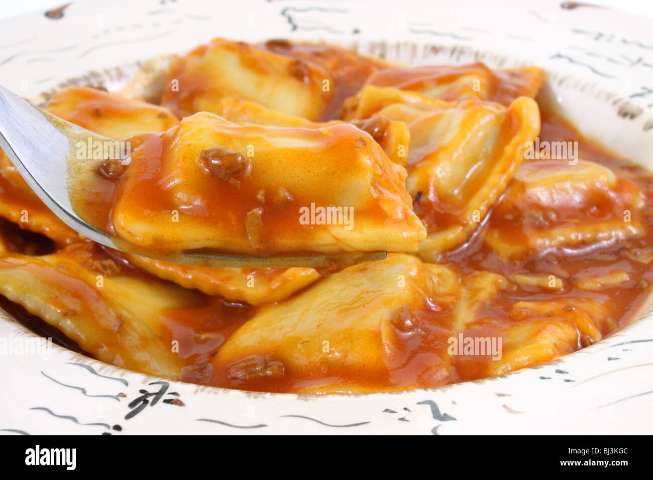 Close view of beef ravioli with fork Stock Photo - Alamy