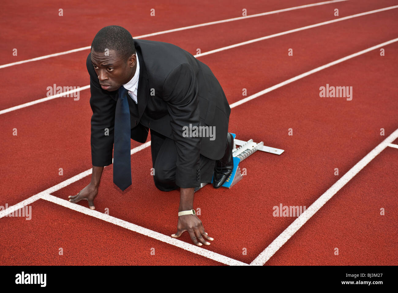 Starting blocks in suit hi-res stock photography and images - Alamy