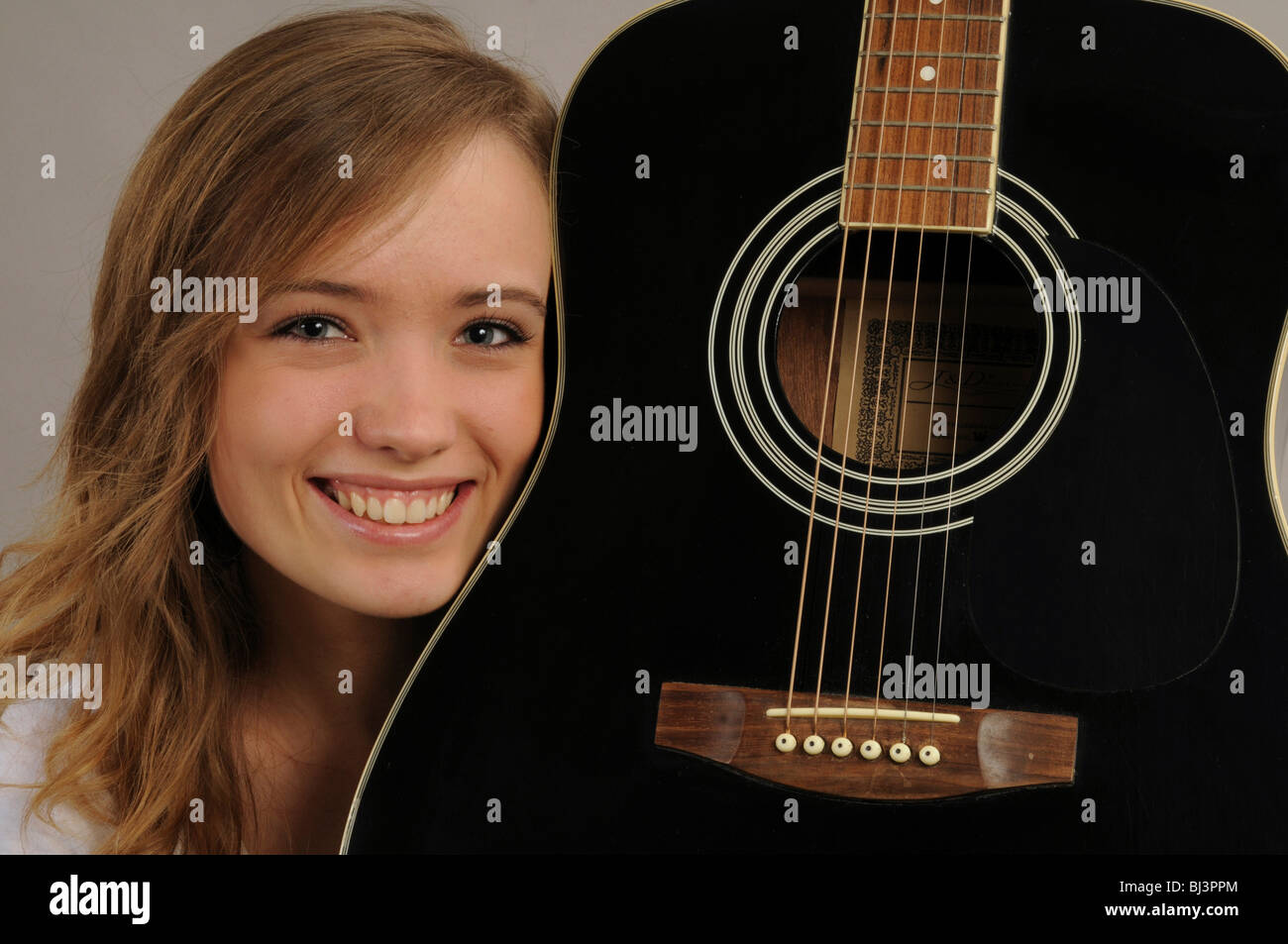 Dark skinned teen guitar hi-res stock photography and images - Alamy