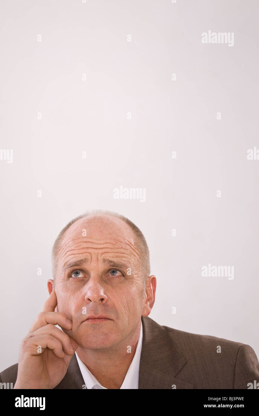 Thoughtful thoughtfully unsmiling unsmilingly hi-res stock photography ...