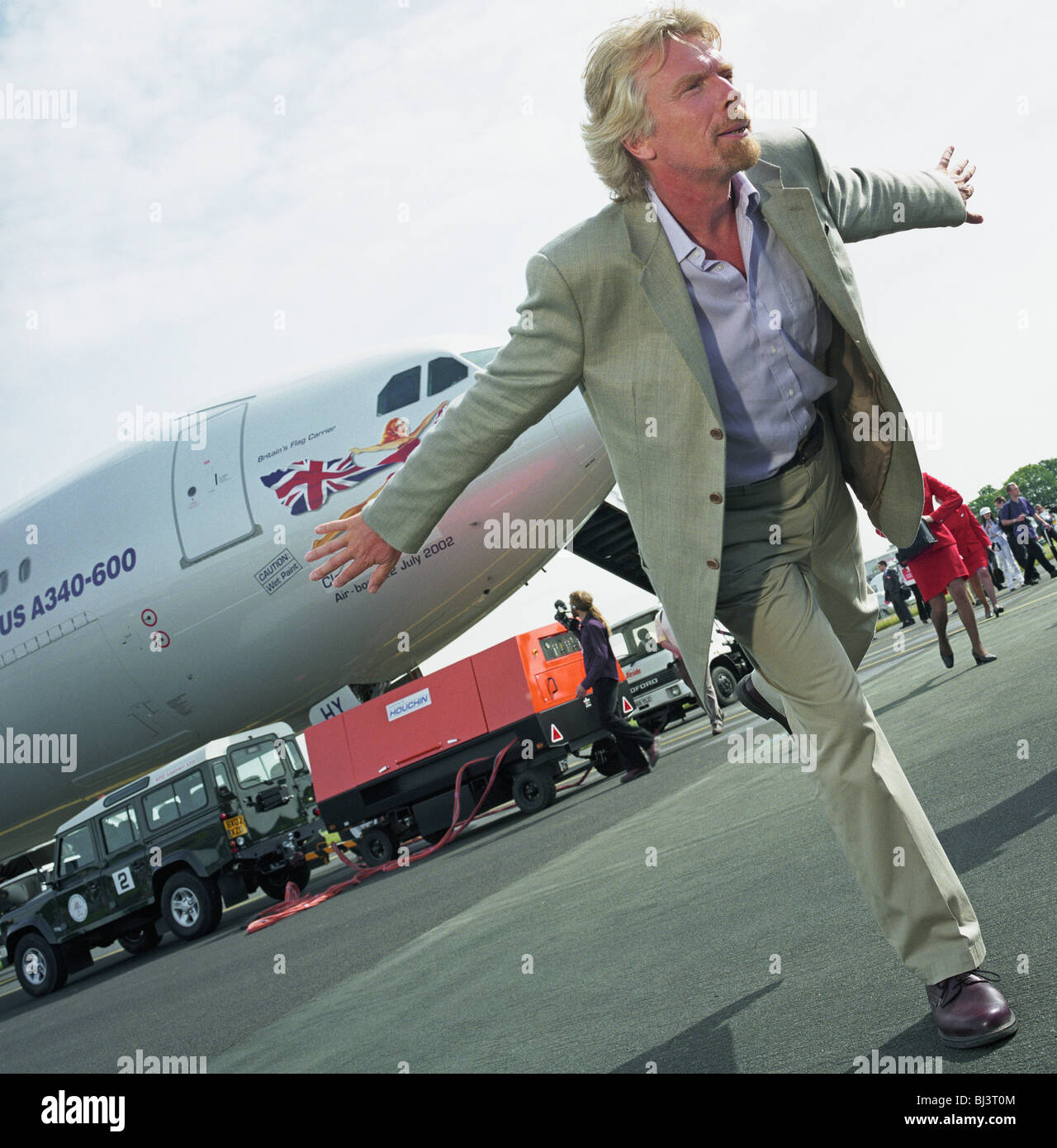 Virgin Chairman Sir Richard Branson Performs In Front Of The Media