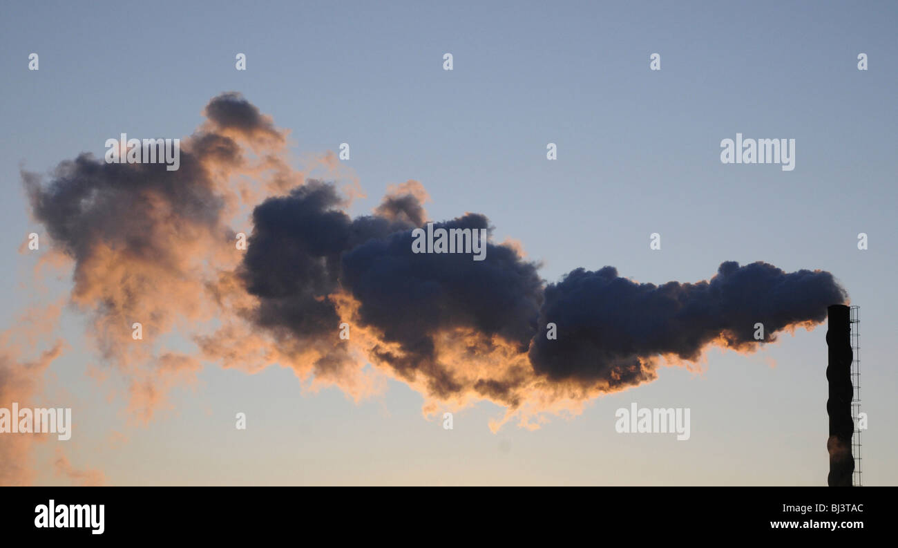 Smoke from an industrial chimney in the evening Stock Photo - Alamy