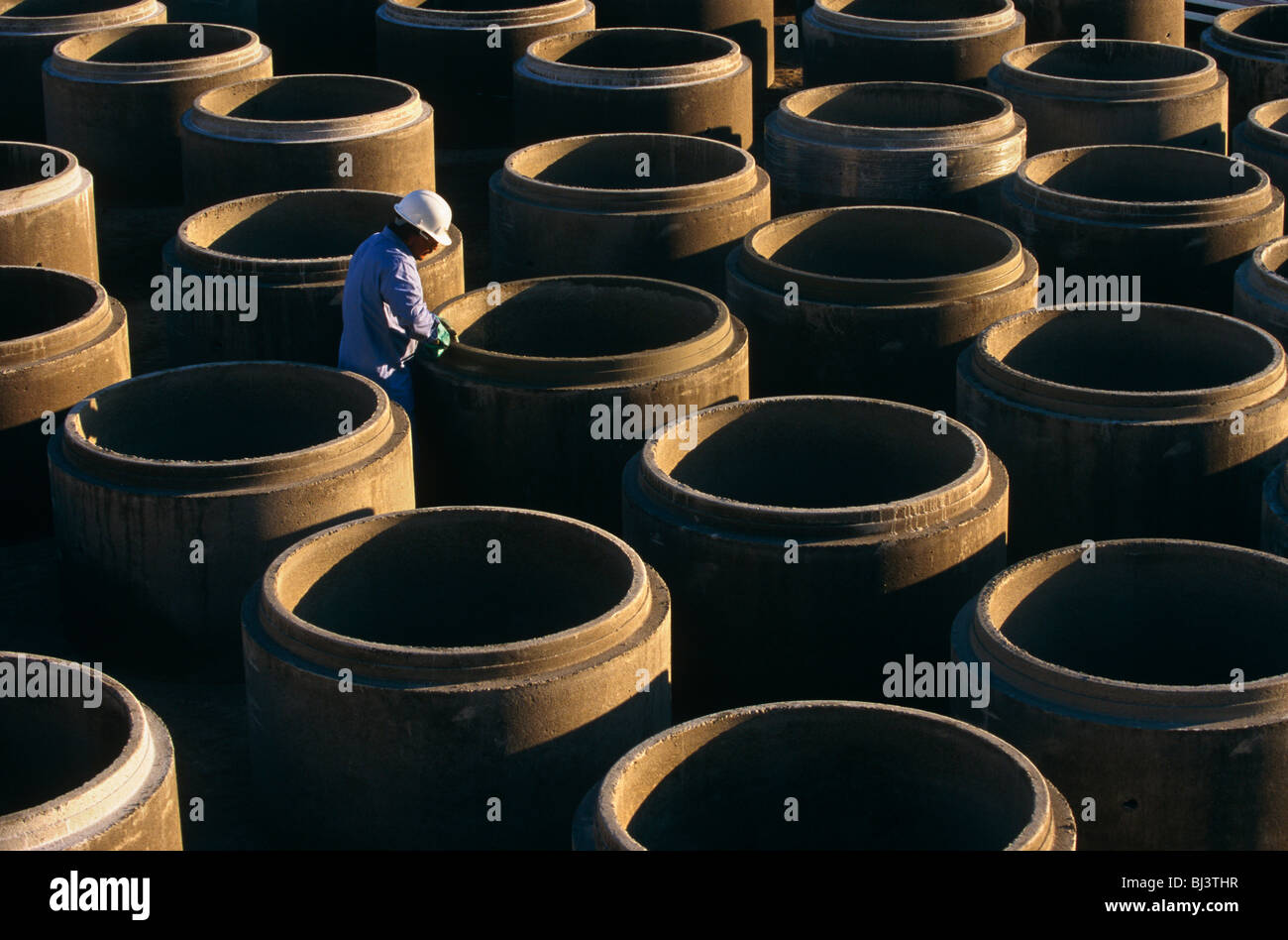 Precast concrete pipes are prepared for distribution by a Mexican-born ...