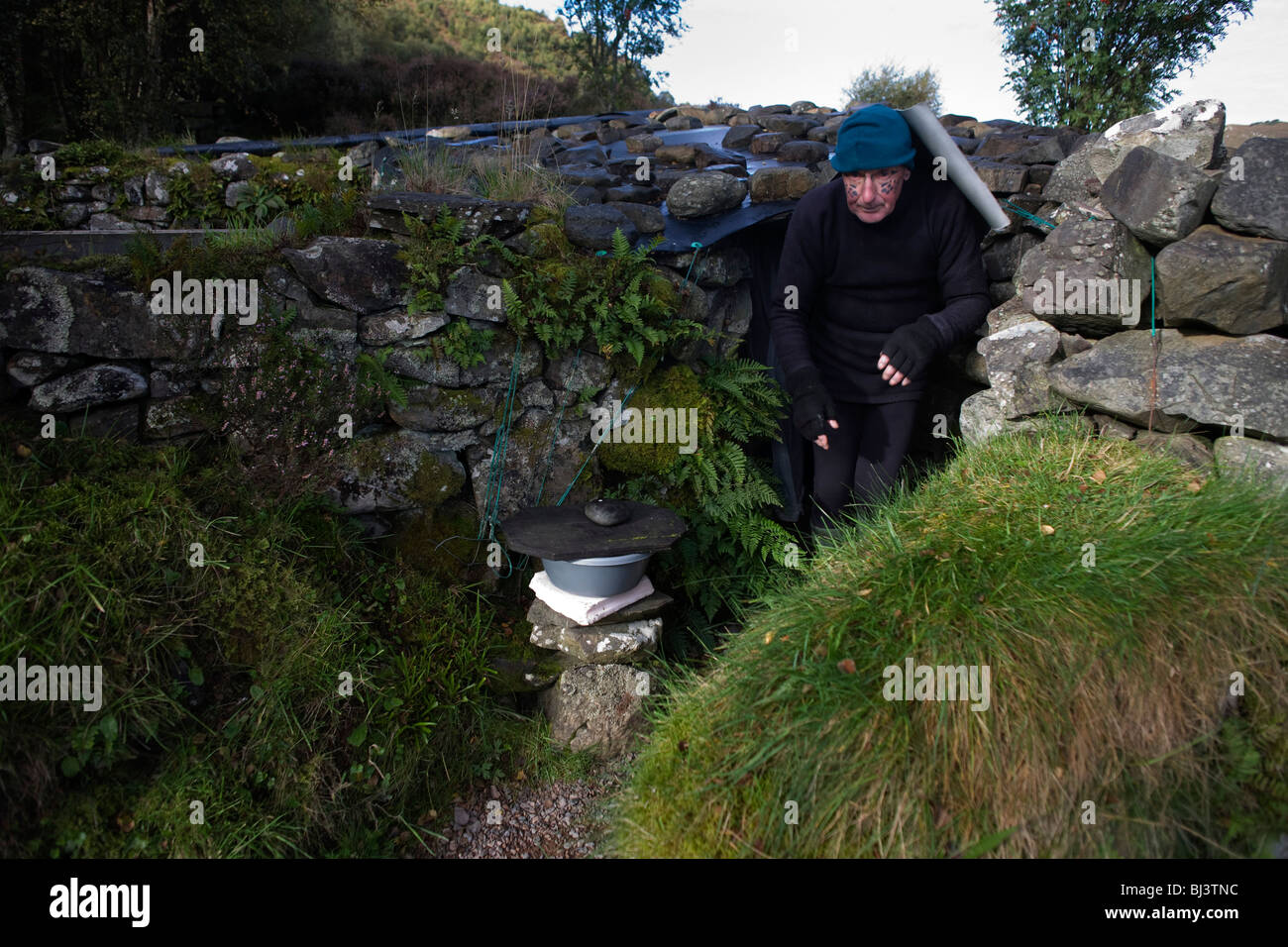 Tattooed hermit Tom Leppard emerges from the entrance of his secret ...
