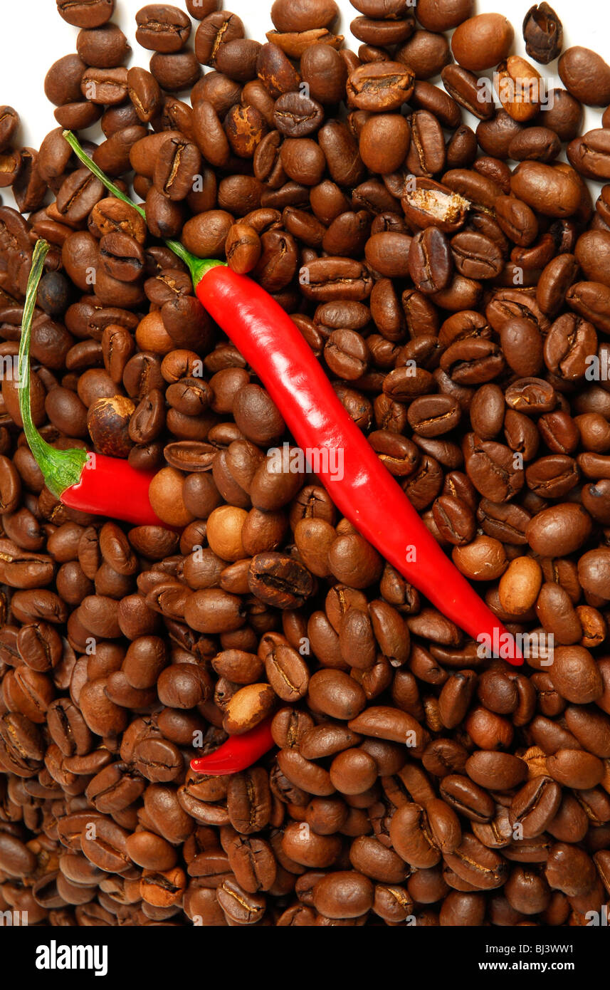Chili peppers with coffee beans Stock Photo - Alamy