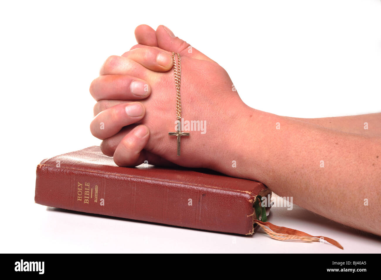 Praying over a Bible Stock Photo - Alamy