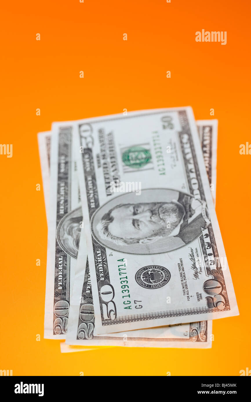 the photo shot of dollars on color background Stock Photo - Alamy