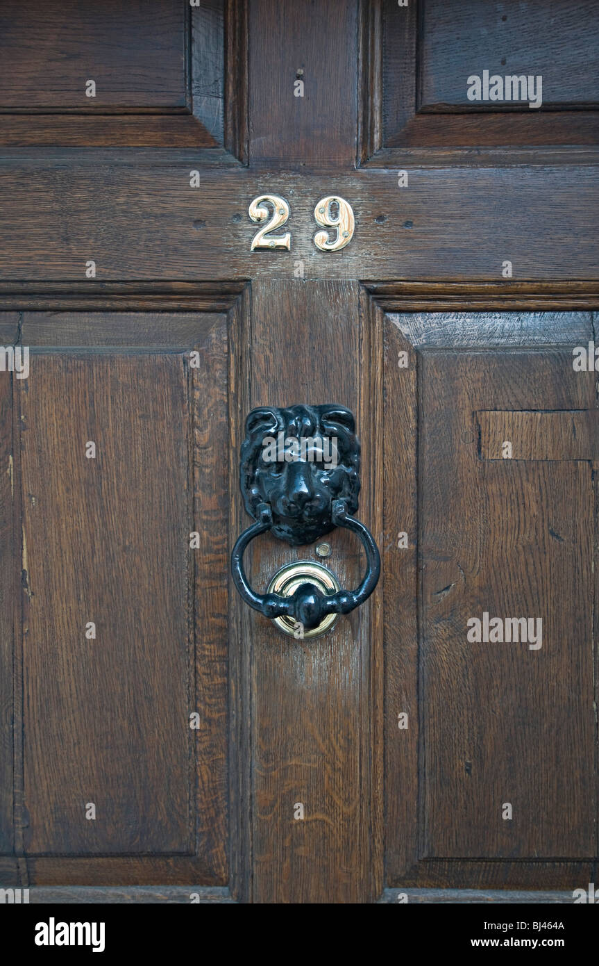 door knocker on wooden door with number 29 on Stock Photo - Alamy