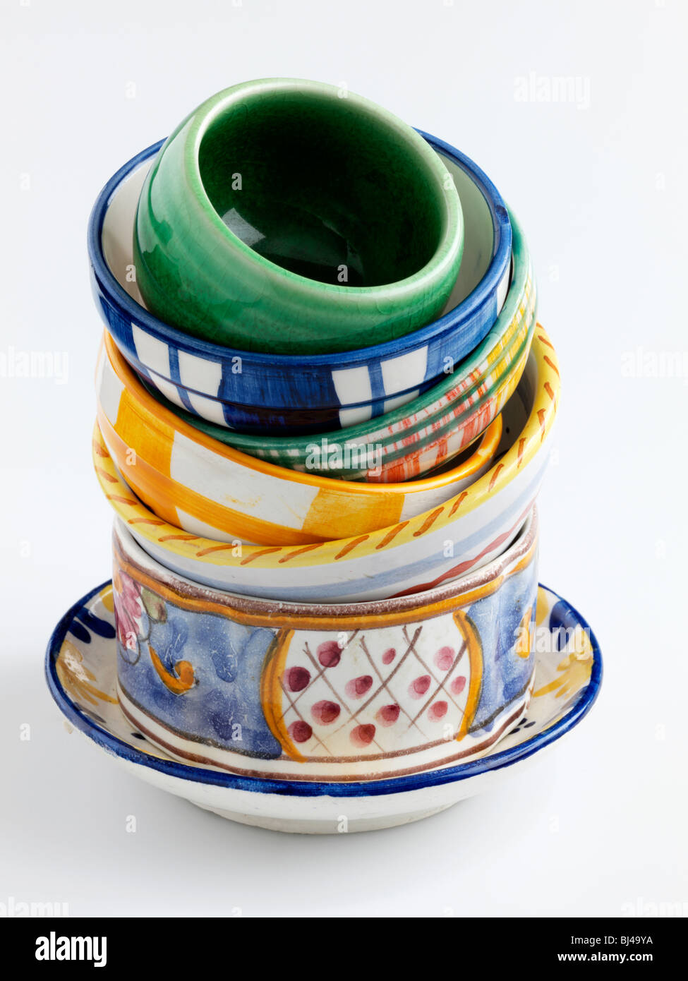 Colourful painted crockery Stock Photo - Alamy