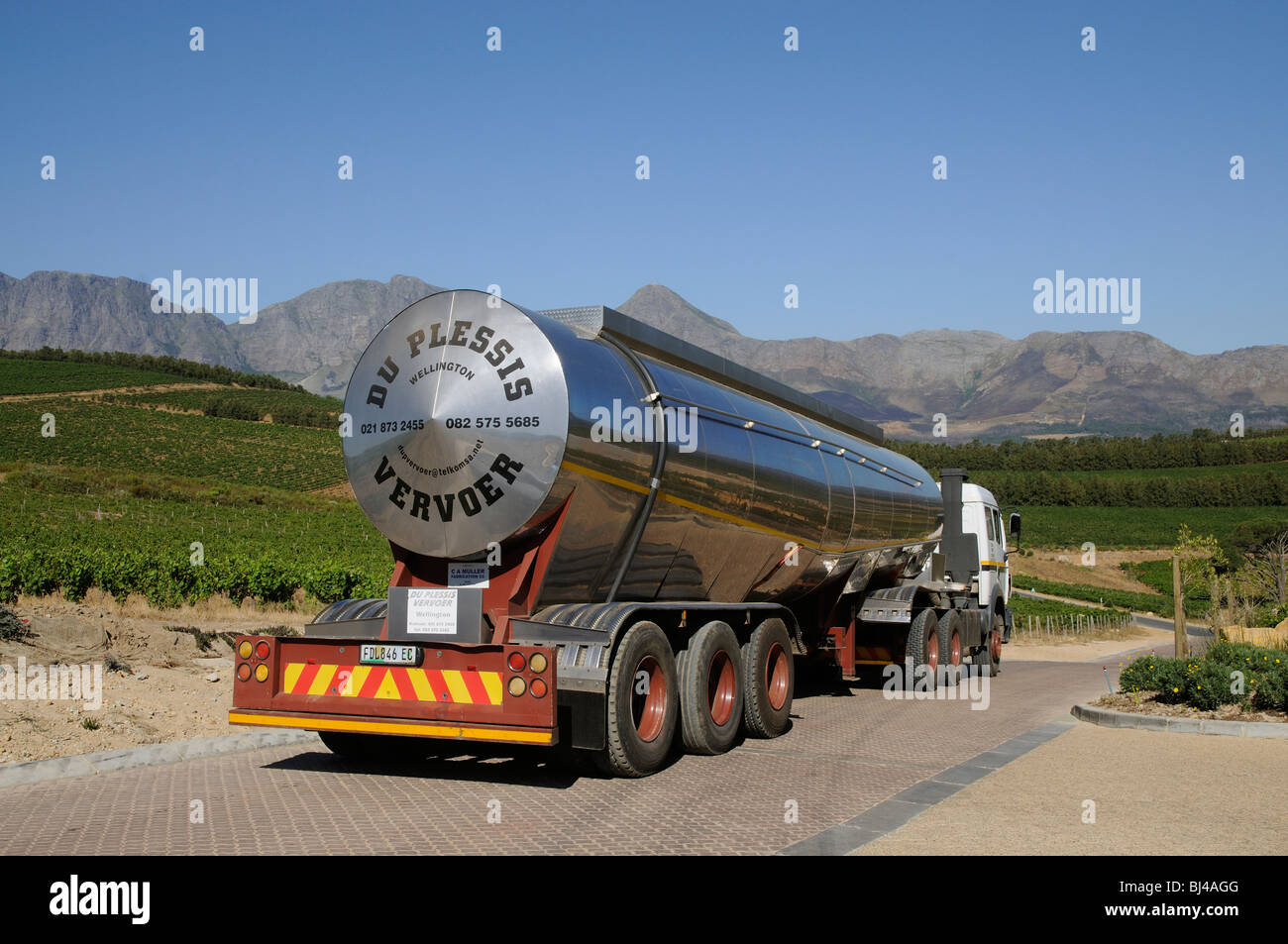 Wine tanker driving through the Waterkloof Wines vineyard close to ...