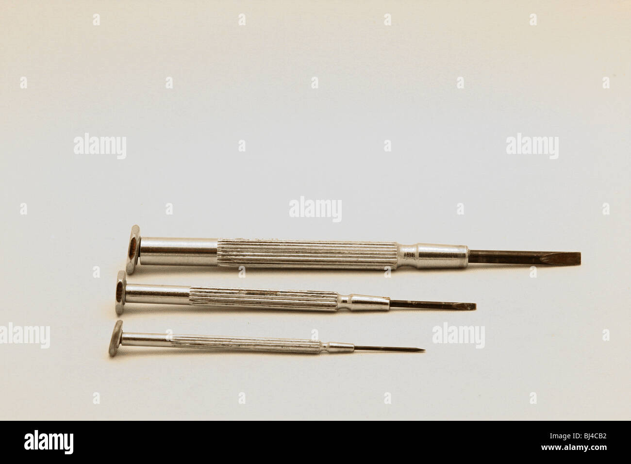 Silver colored small screw driver set Stock Photo - Alamy
