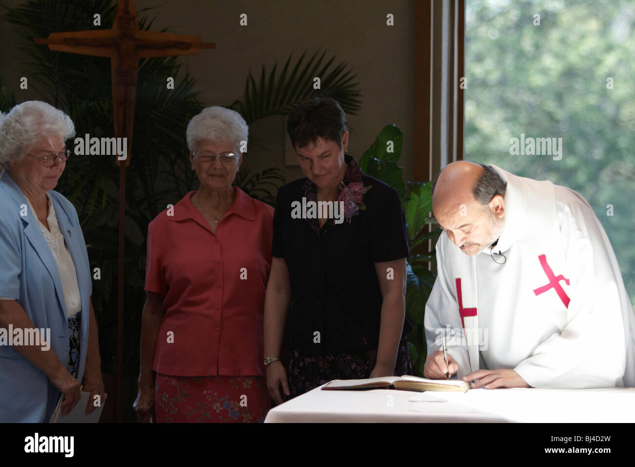 A Catholic Mass celebrating a nun joining a religious order Stock Photo ...