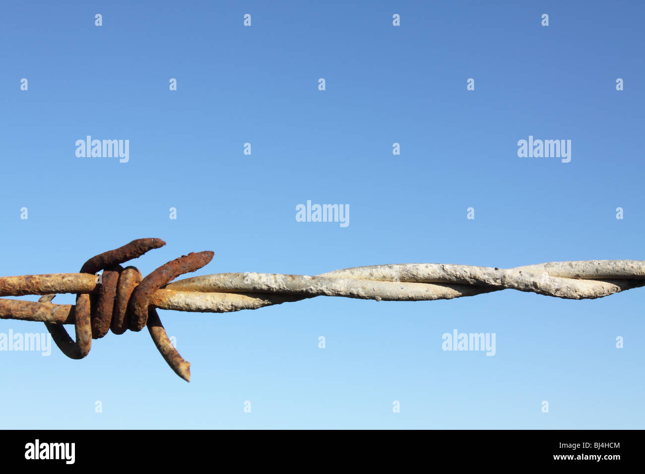 Barrier boundary containment fence border barb barbed wire detail hi-res stock photography and ...