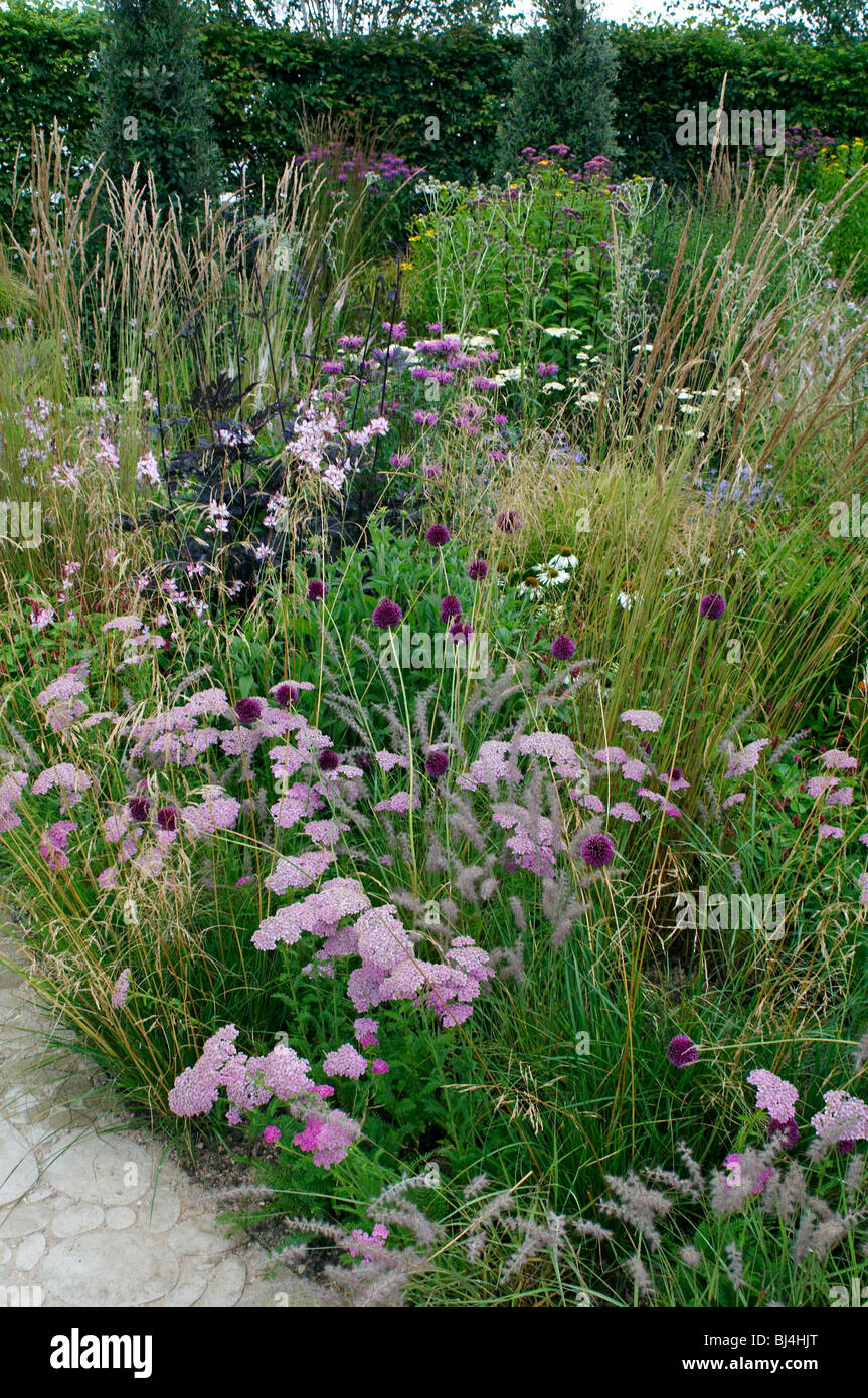 A natural planted flower border in a Cottage Garden Stock Photo - Alamy