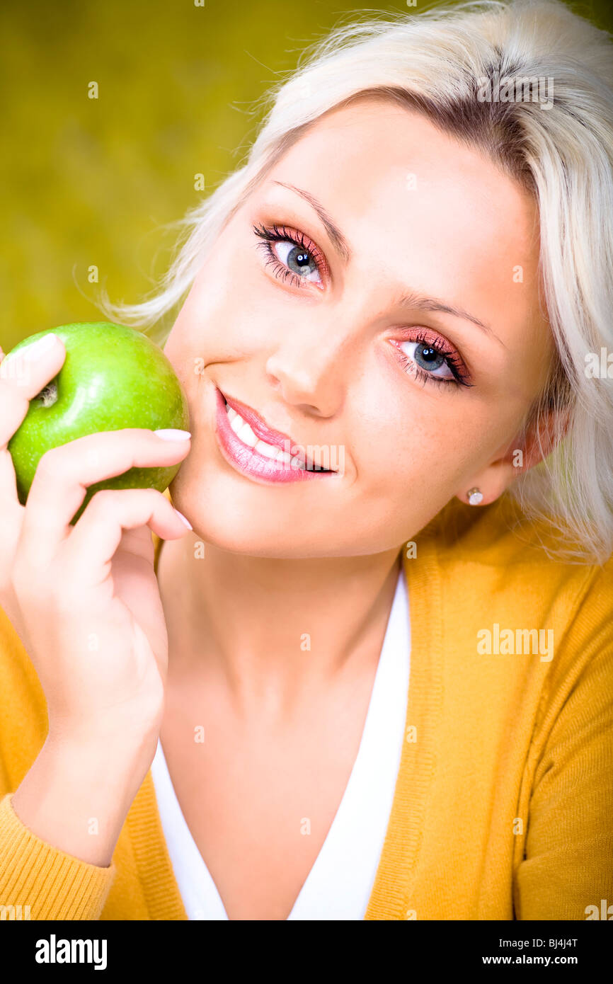 Young woman with apple Stock Photo - Alamy