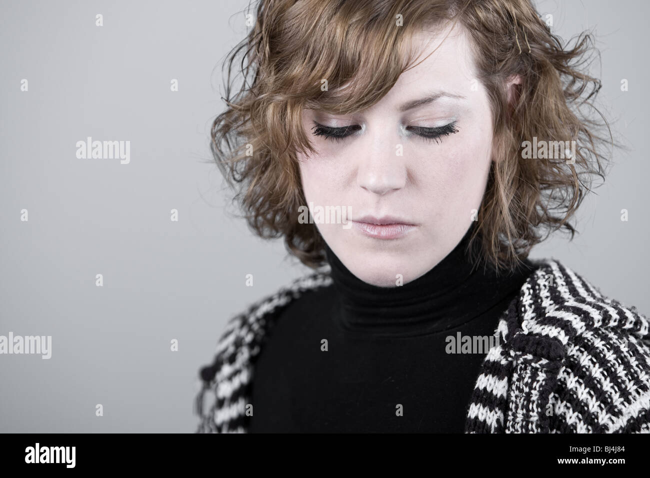 Shot of a Pretty Female Looking Down Stock Photo - Alamy