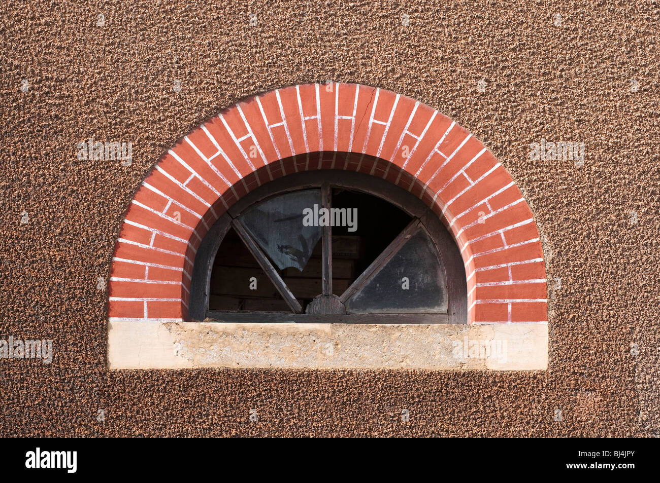 Half-round window with painted false brickwork arch - France Stock ...