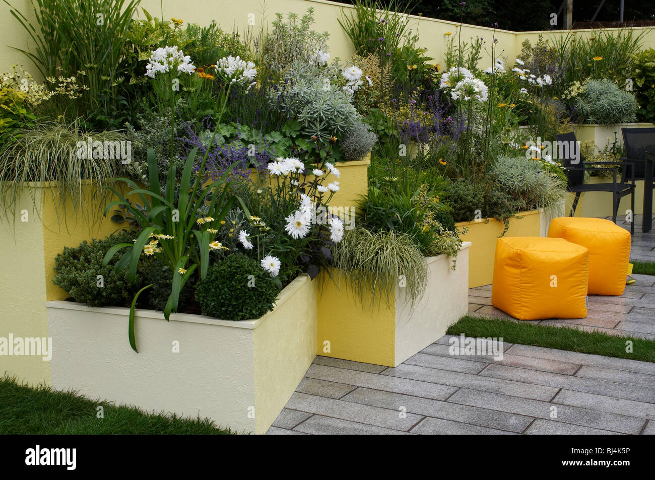 A colourful contemporary courtyard office garden with planted ...