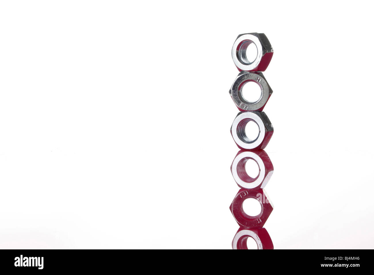 stack of metal nuts DIY plumbing Stock Photo - Alamy