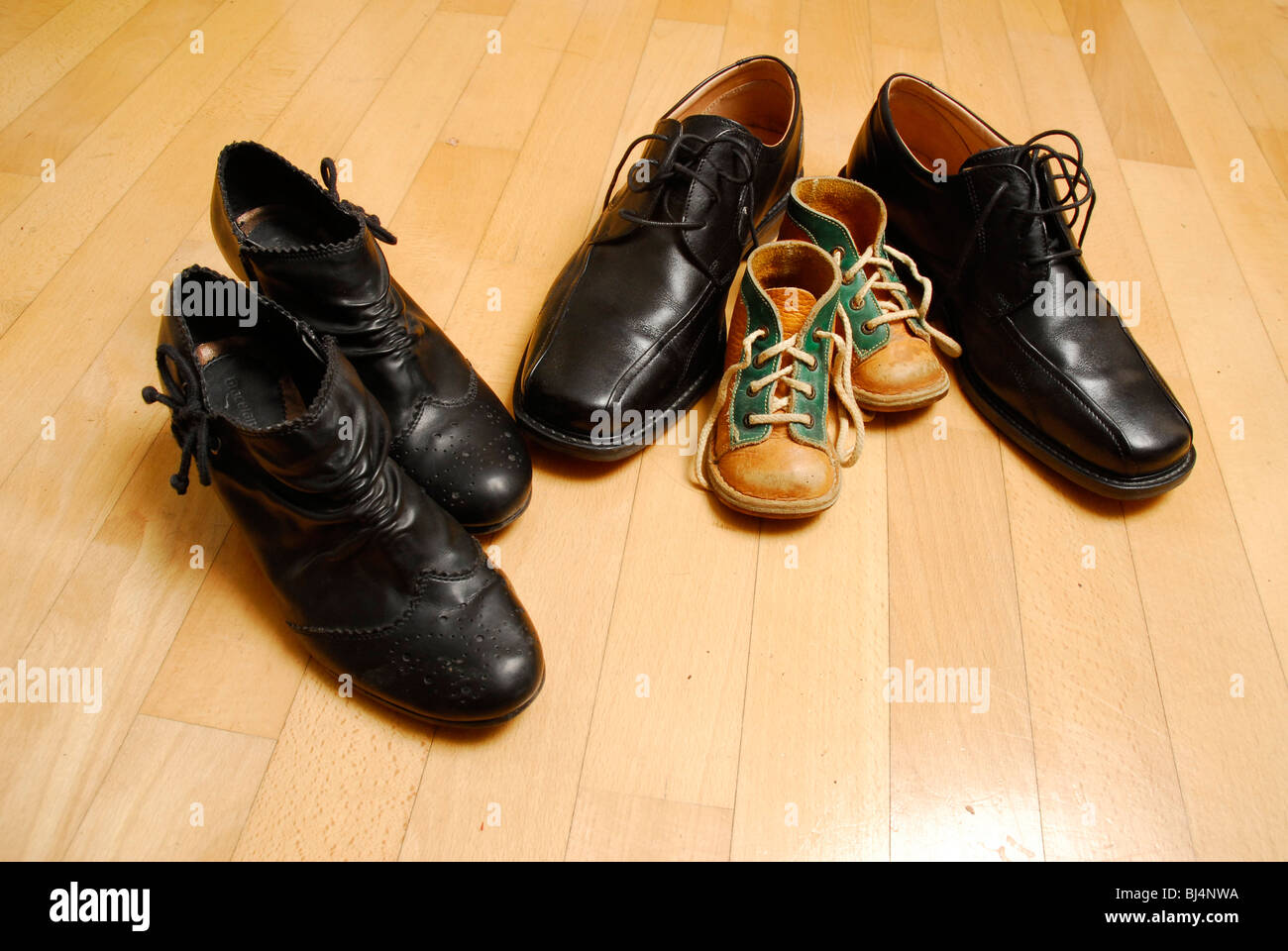 Shoes of a family, symbolic image for family Stock Photo - Alamy