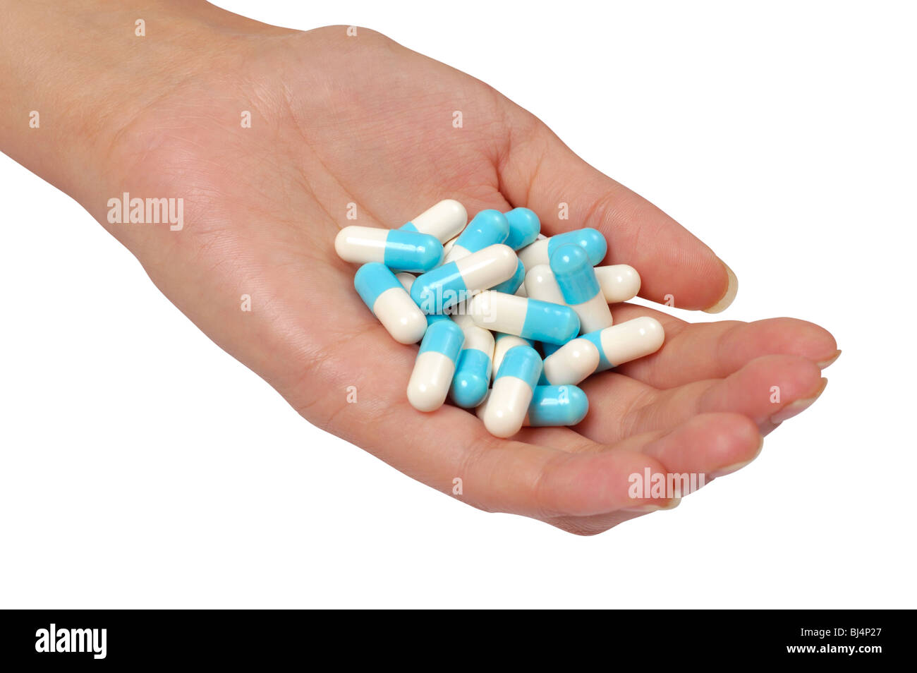 Full hand of medication capsules isolated on white background Stock ...