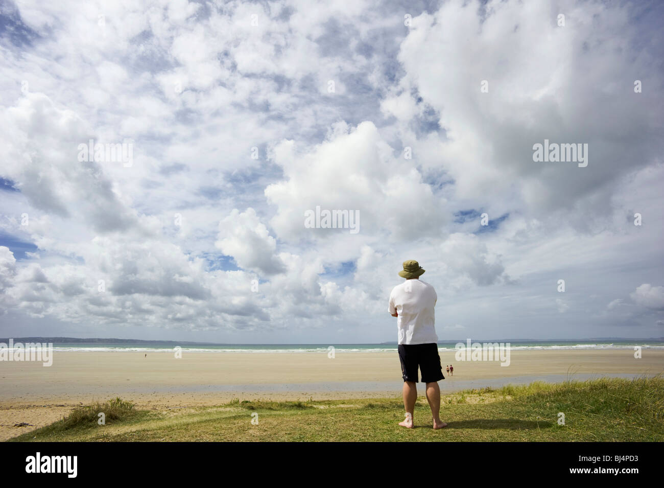 A man on a dune overlooking the sea, Brittany, France, Europe Stock ...