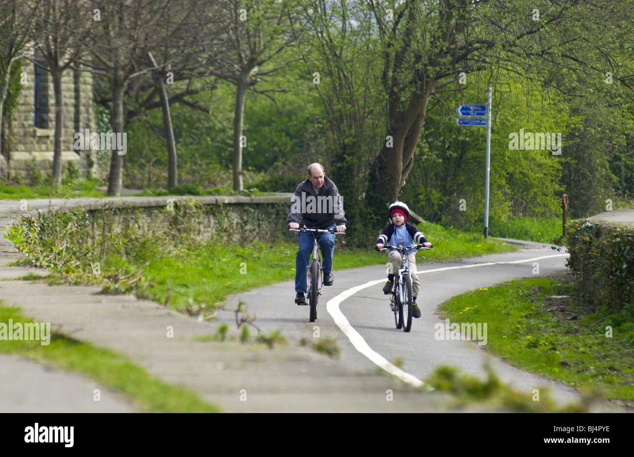 Cyclists on the Sustrans cycle path way at the former Mangotsfield ...