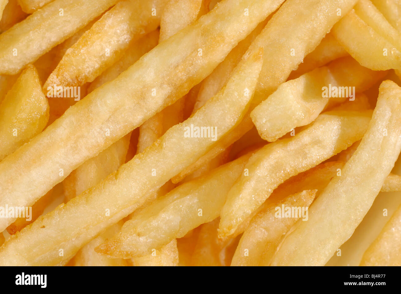 French fried potatoes abstract texture macro background Stock Photo - Alamy