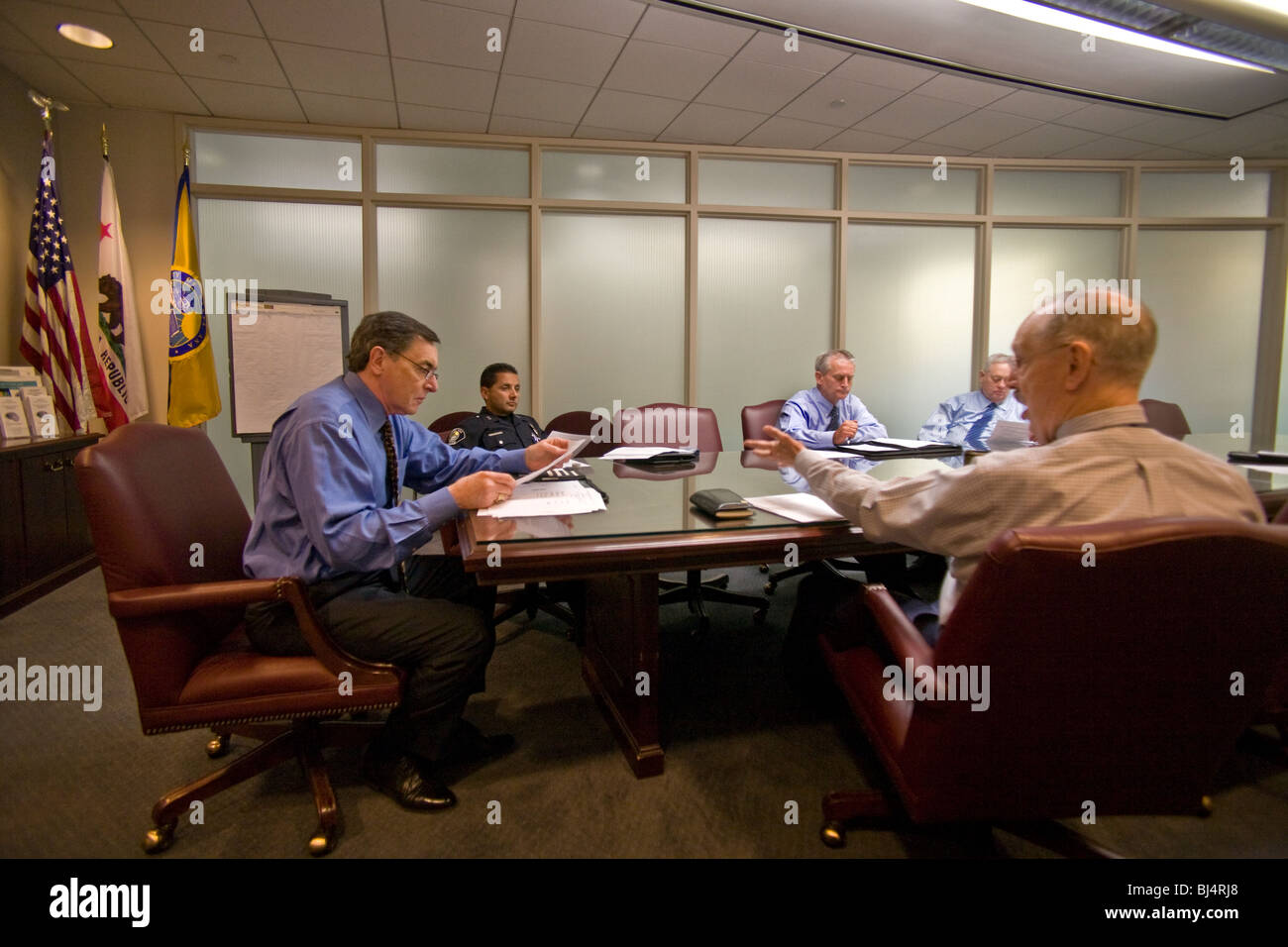 The Santa Ana, California, Chief of Police (blue shirt) conducts a ...